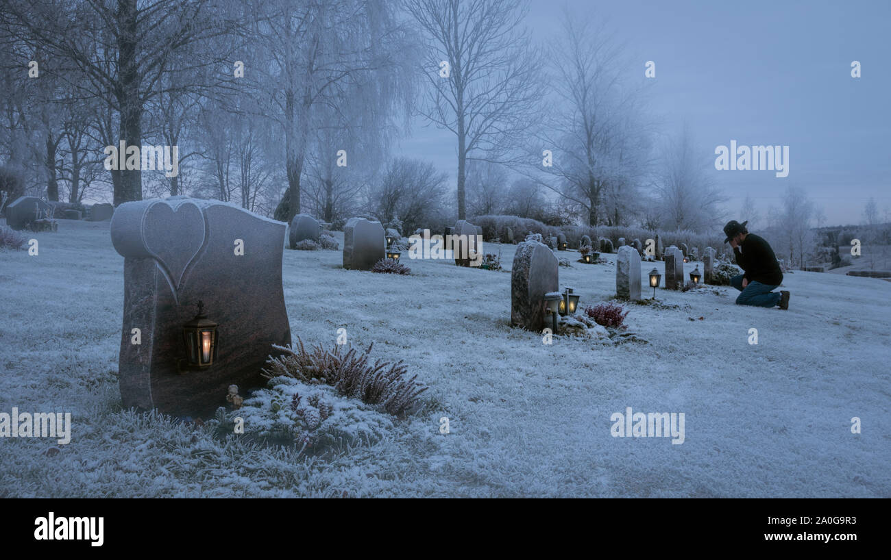 It´s a very sad and emotional scene in a lutheran graveyard Stock Photo ...