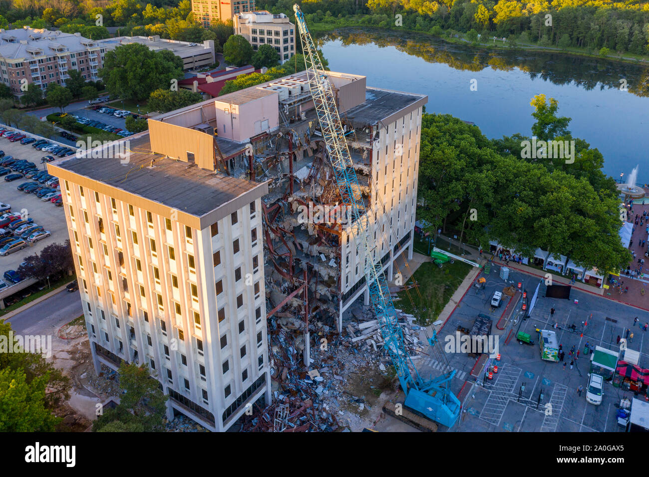 Aerial view of an office building under demolition by a wrecking ball ...