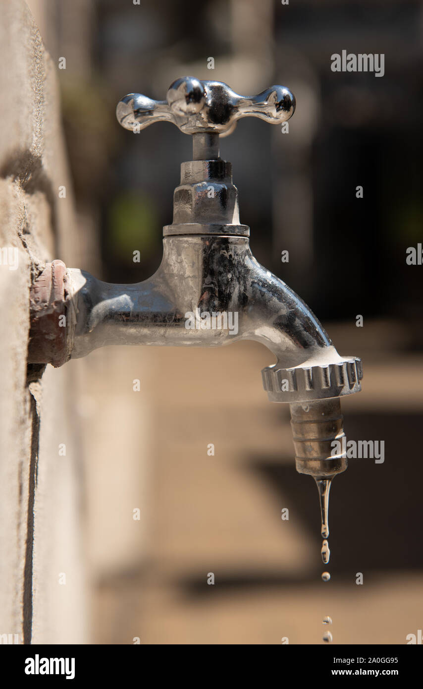 Rustic tap losing water Stock Photo - Alamy