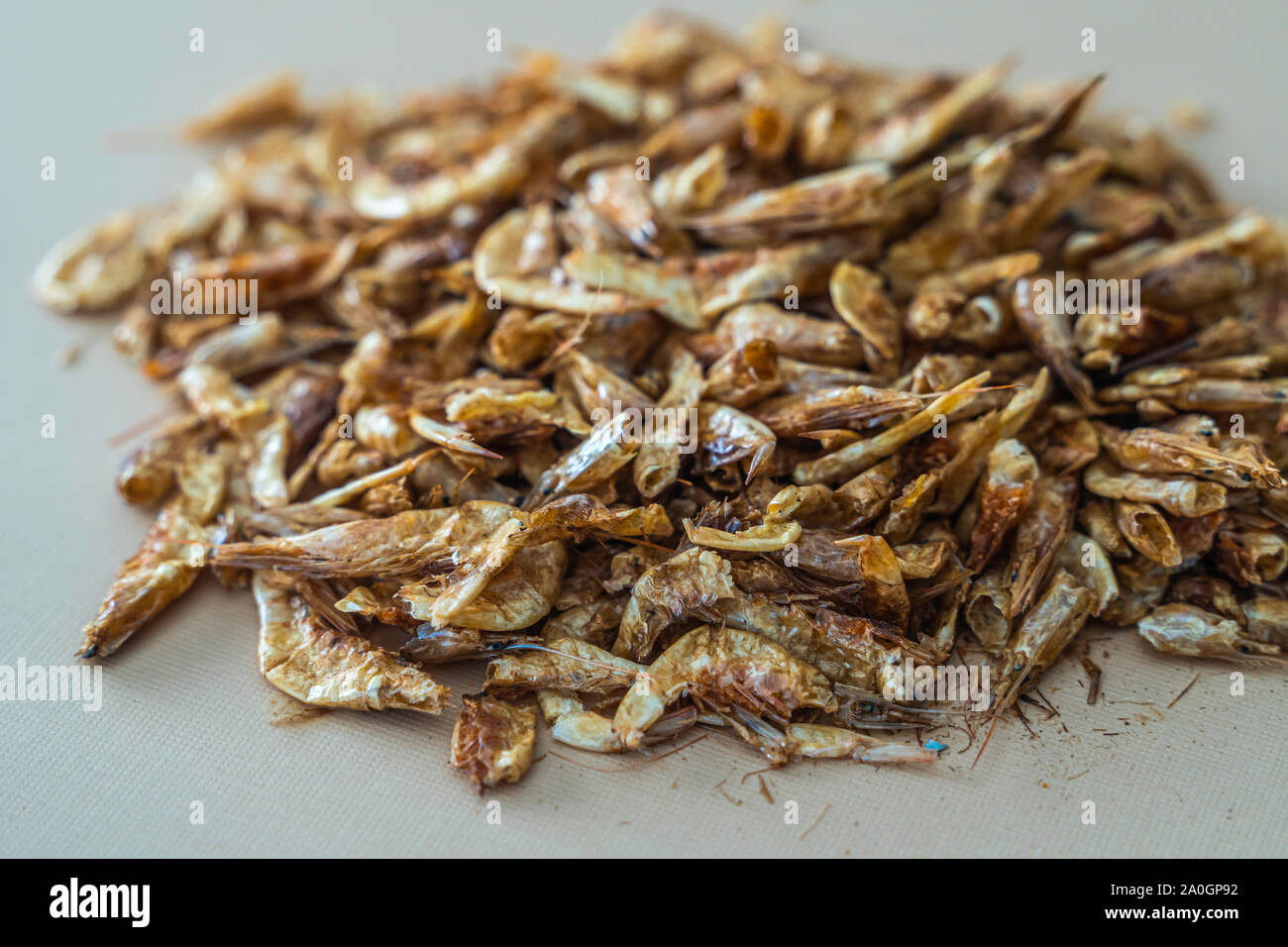 Pile of Dried Crayfish on brown background Stock Photo - Alamy