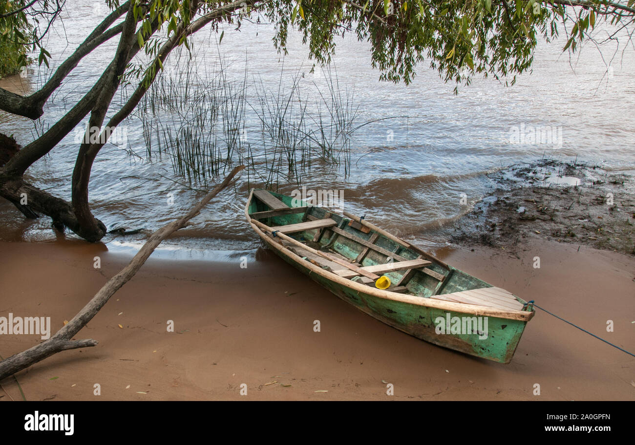 A very old row boat in the coast of Parana river Stock Photo - Alamy