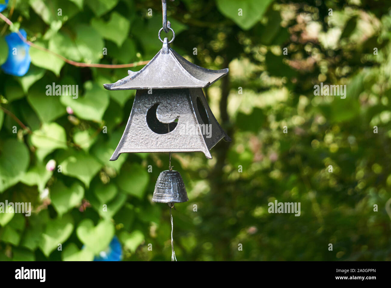 Dark gray metal bell in the shape of a traditional lantern with moon ...