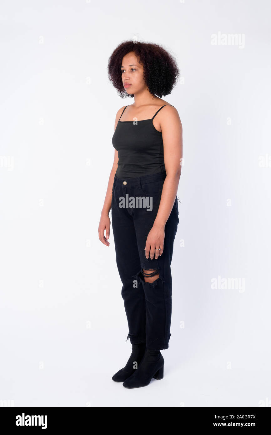 Full body shot of young beautiful African woman thinking Stock Photo ...