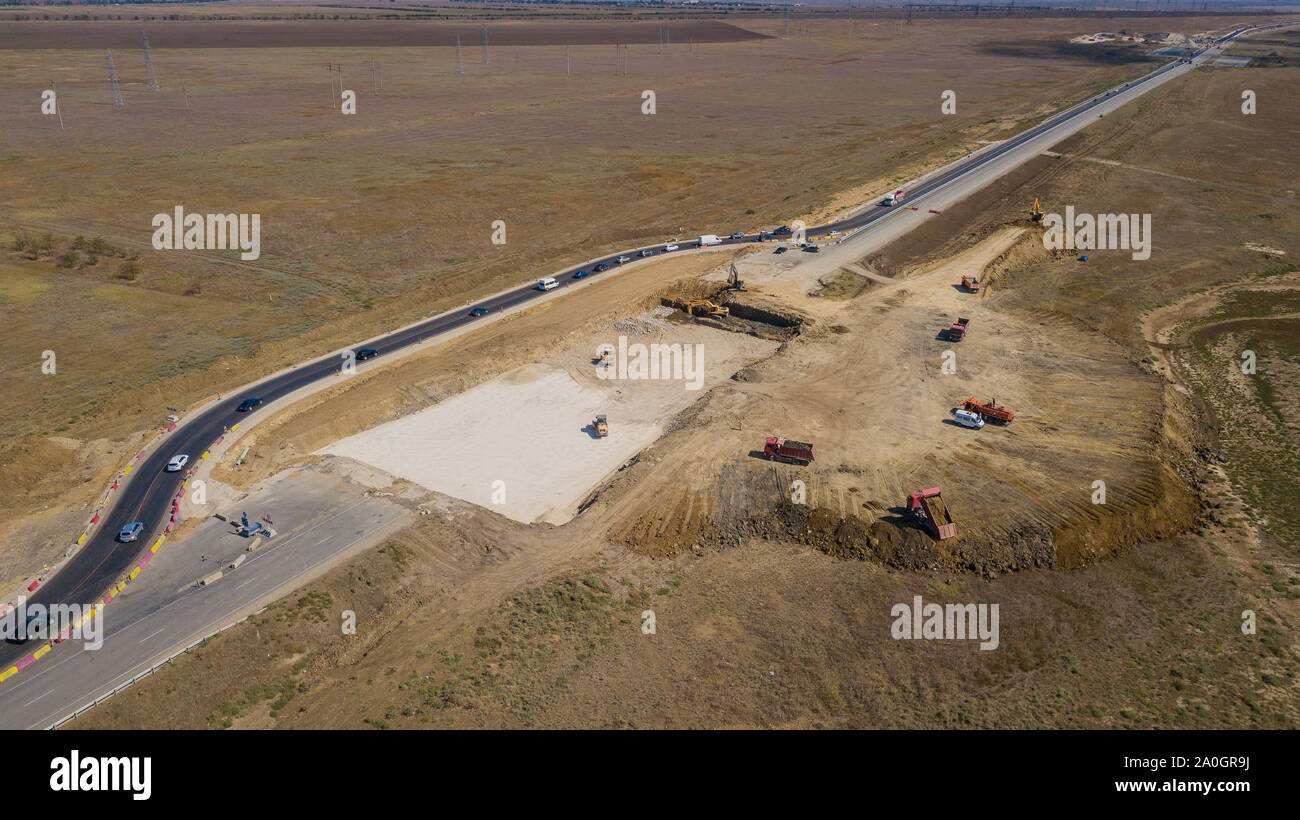 Drone fly over the road on which the cars are traveling, and the ...