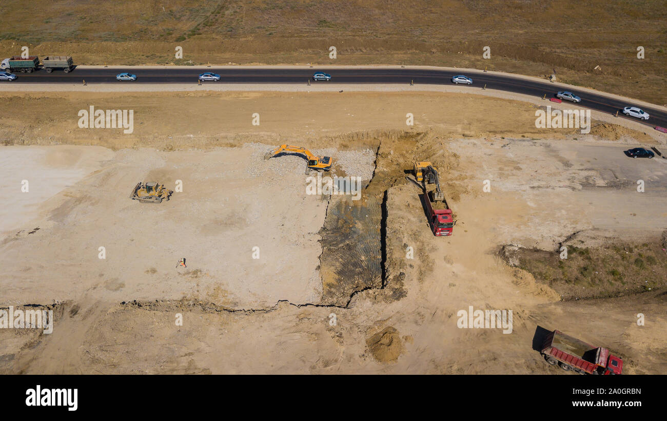 Drone fly over the road on which the cars are traveling, and the ...