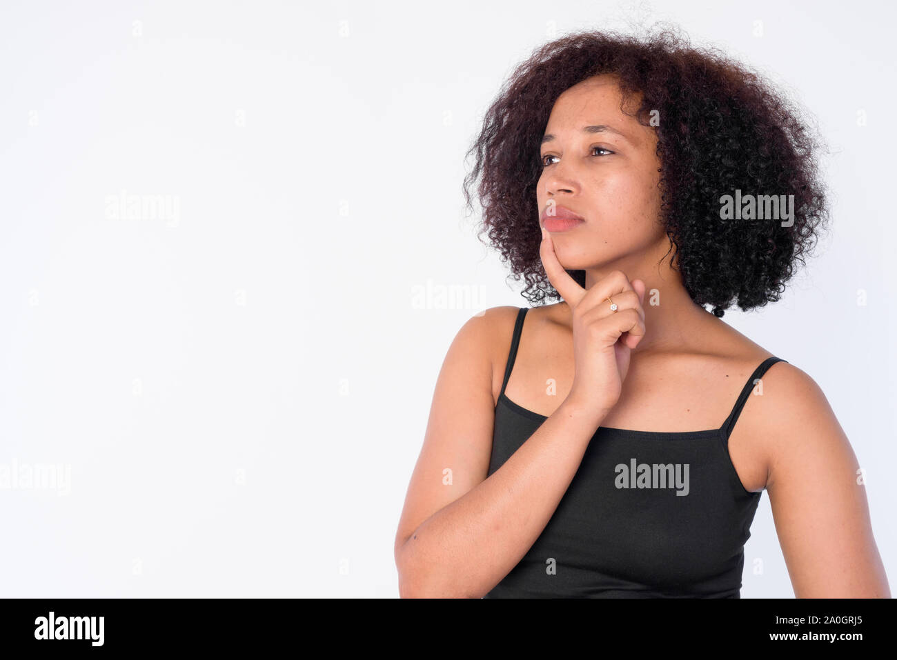 Face of young beautiful African woman thinking and looking up Stock ...