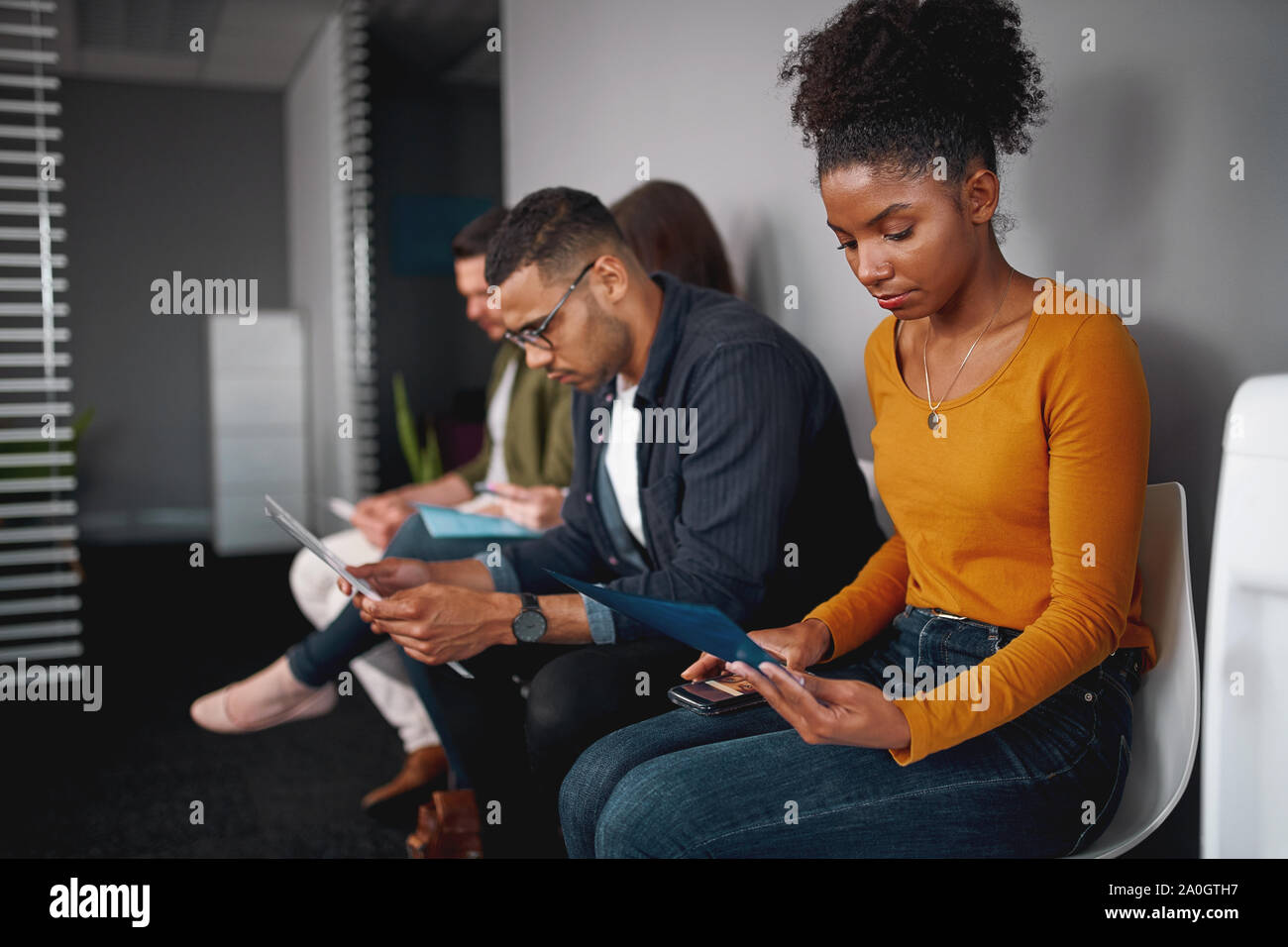Group of diverse applicants preparing for employment interview sitting ...