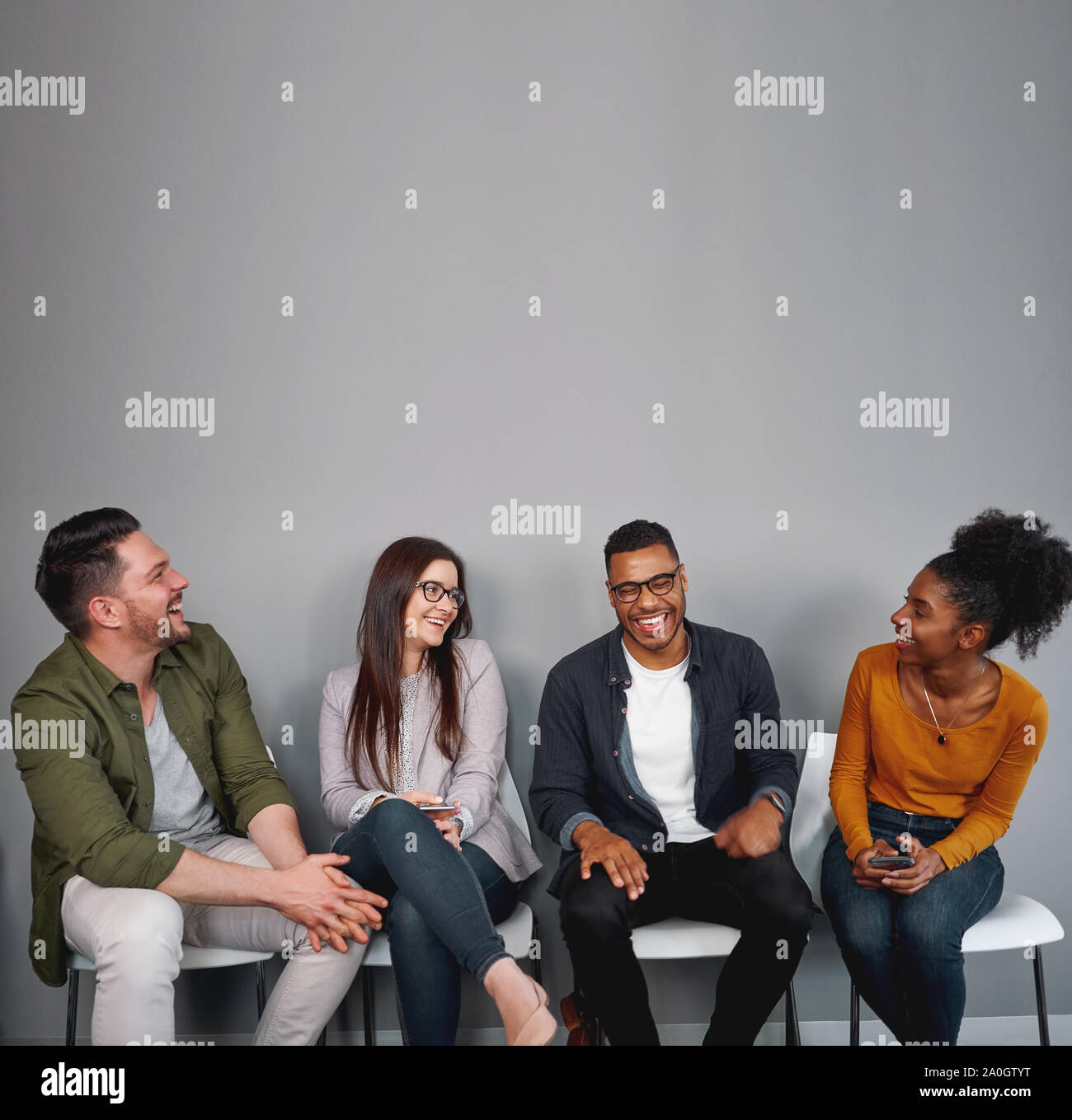 Young man sitting chair happy casual hi-res stock photography and ...