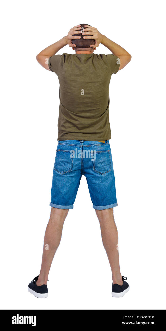 Back view of angry young man in shorts. Rear view. isolated over white ...