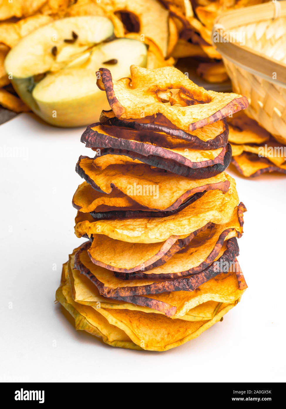 vegetarian dries apples tower, dehydrated healthy snack chips on white ...