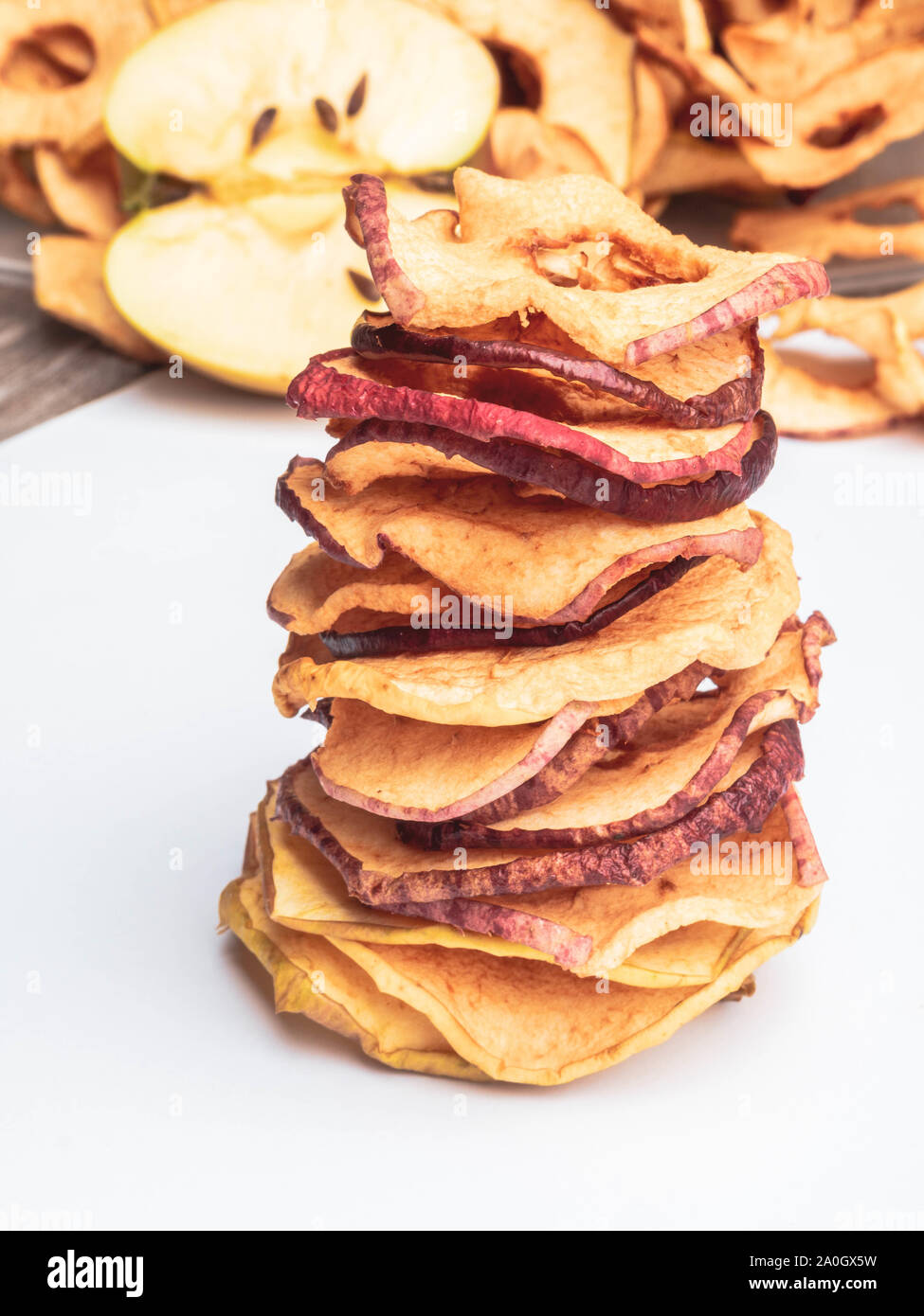 vegetarian dries apples tower, dehydrated healthy snack chips on white ...