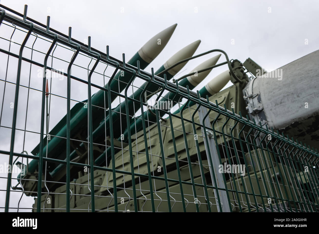 The metal fence behind which is the military equipment guarding the ...