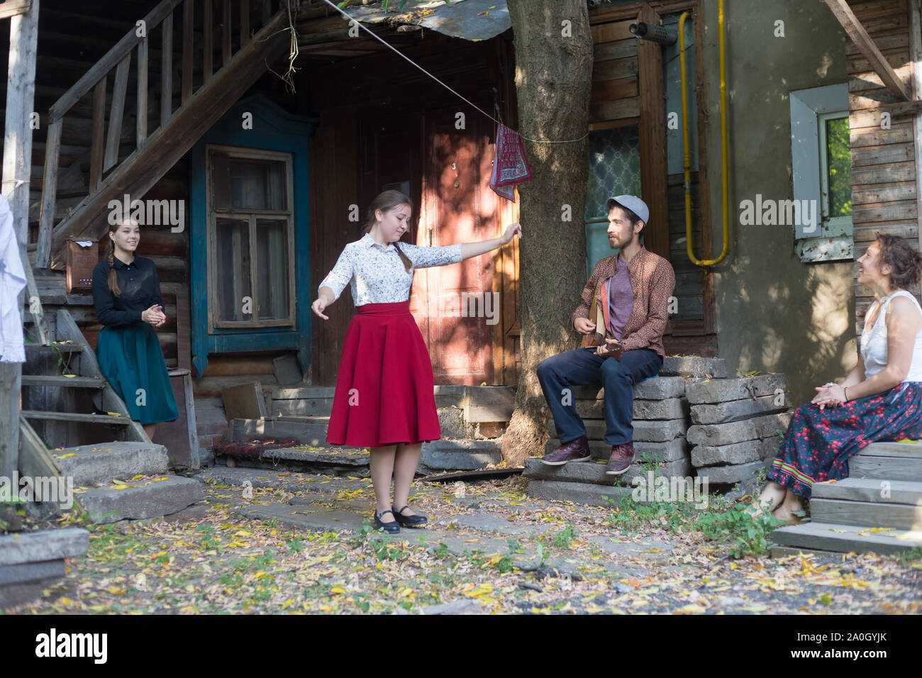 Woman playing balalaika hi-res stock photography and images - Alamy