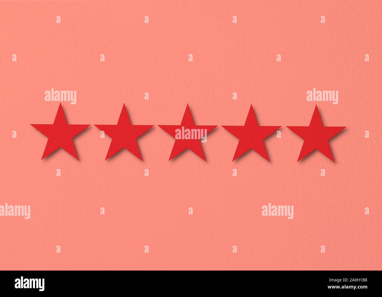 Red stars rating on a pink background, concept of success and ...