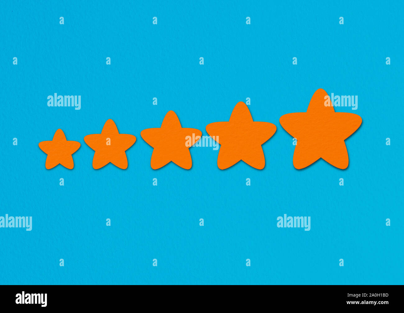 Orange stars rating on a blue background. A conceptual image of a level ...
