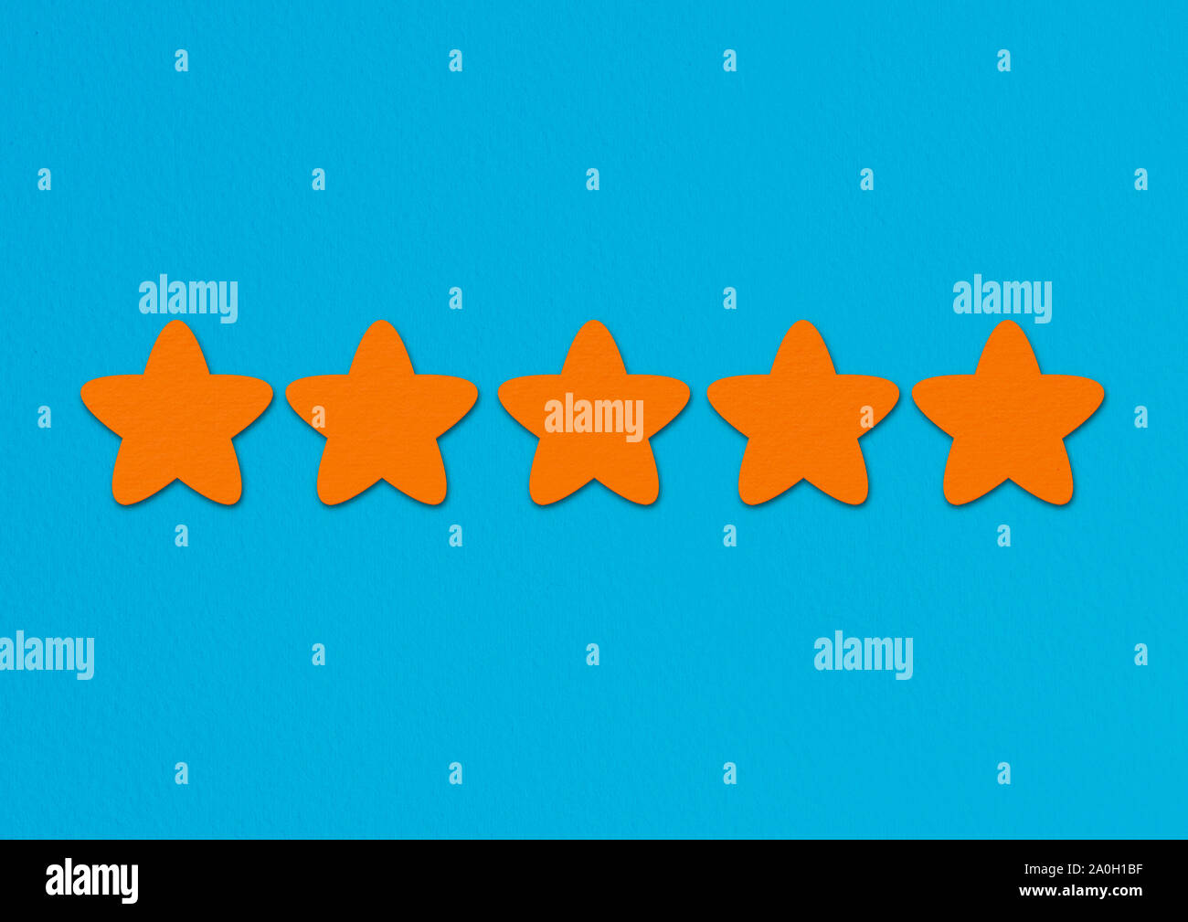 Orange stars rating on a blue background. A conceptual image of a level ...
