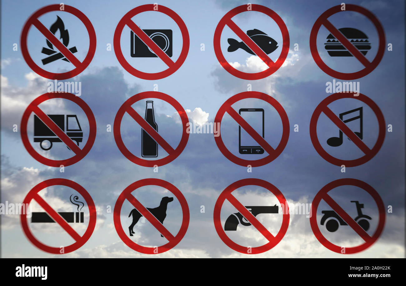 Traffic signs of the ban, background dark clouds Stock Photo - Alamy