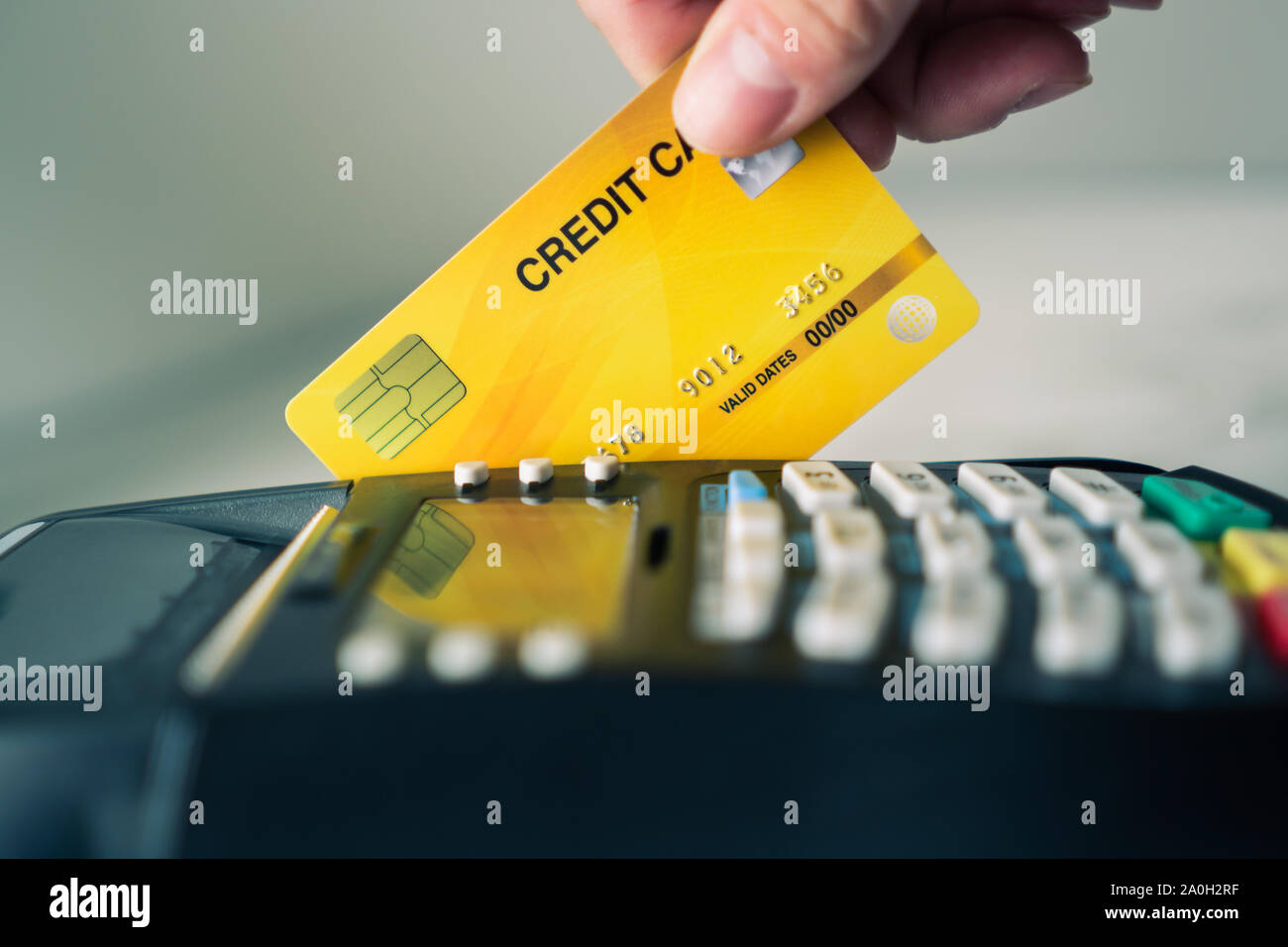 close up hand of customer swiping credit card for buying or selling ...