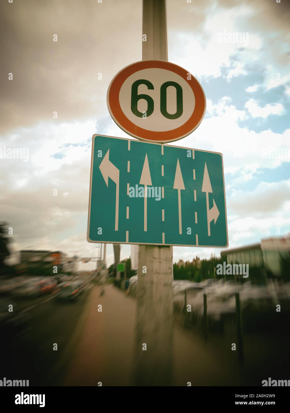 Traffic sign for realignment of vehicles, permissible speed, blurred ...