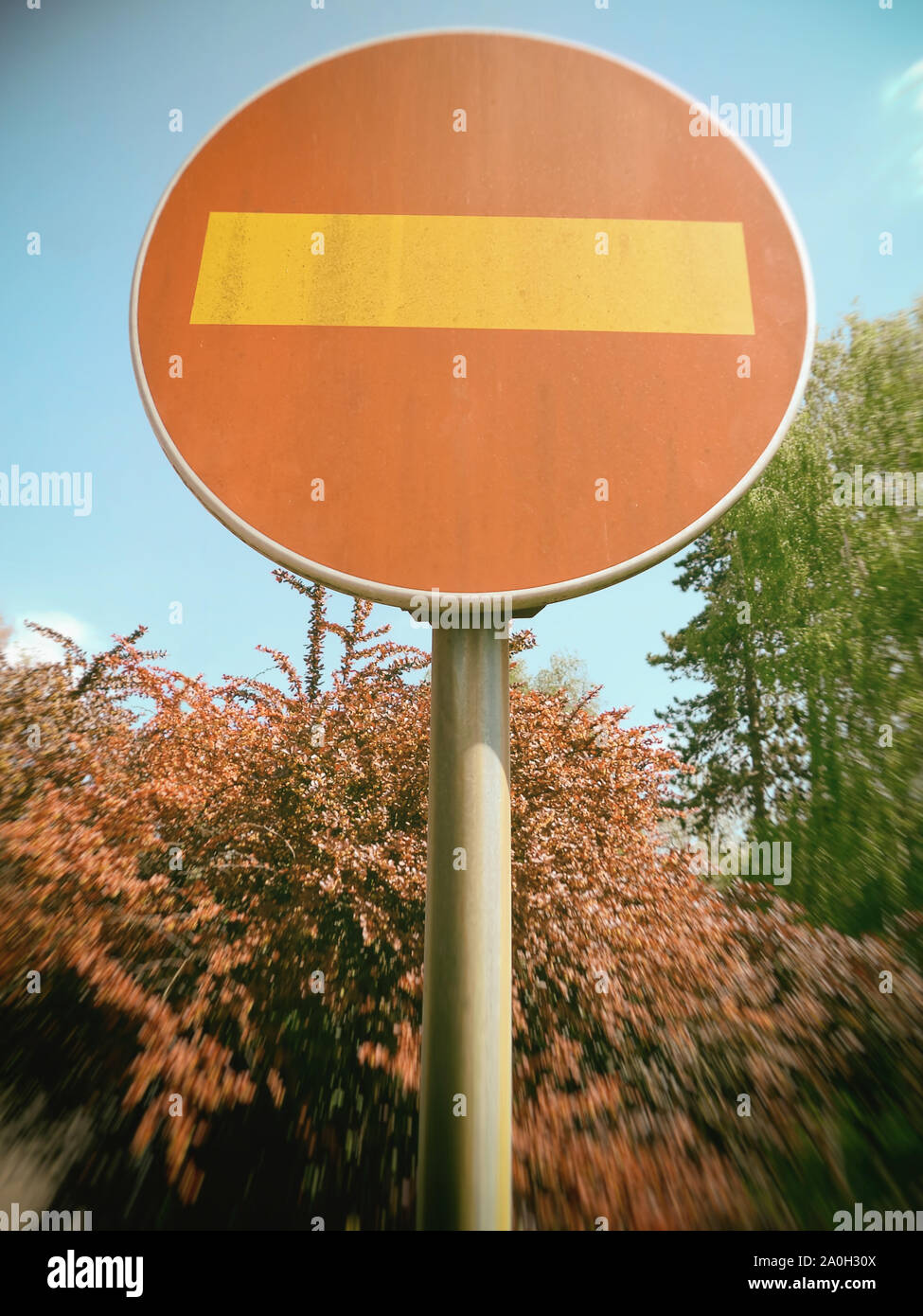 Traffic sign, prohibition of traffic in one direction. Blurred image ...