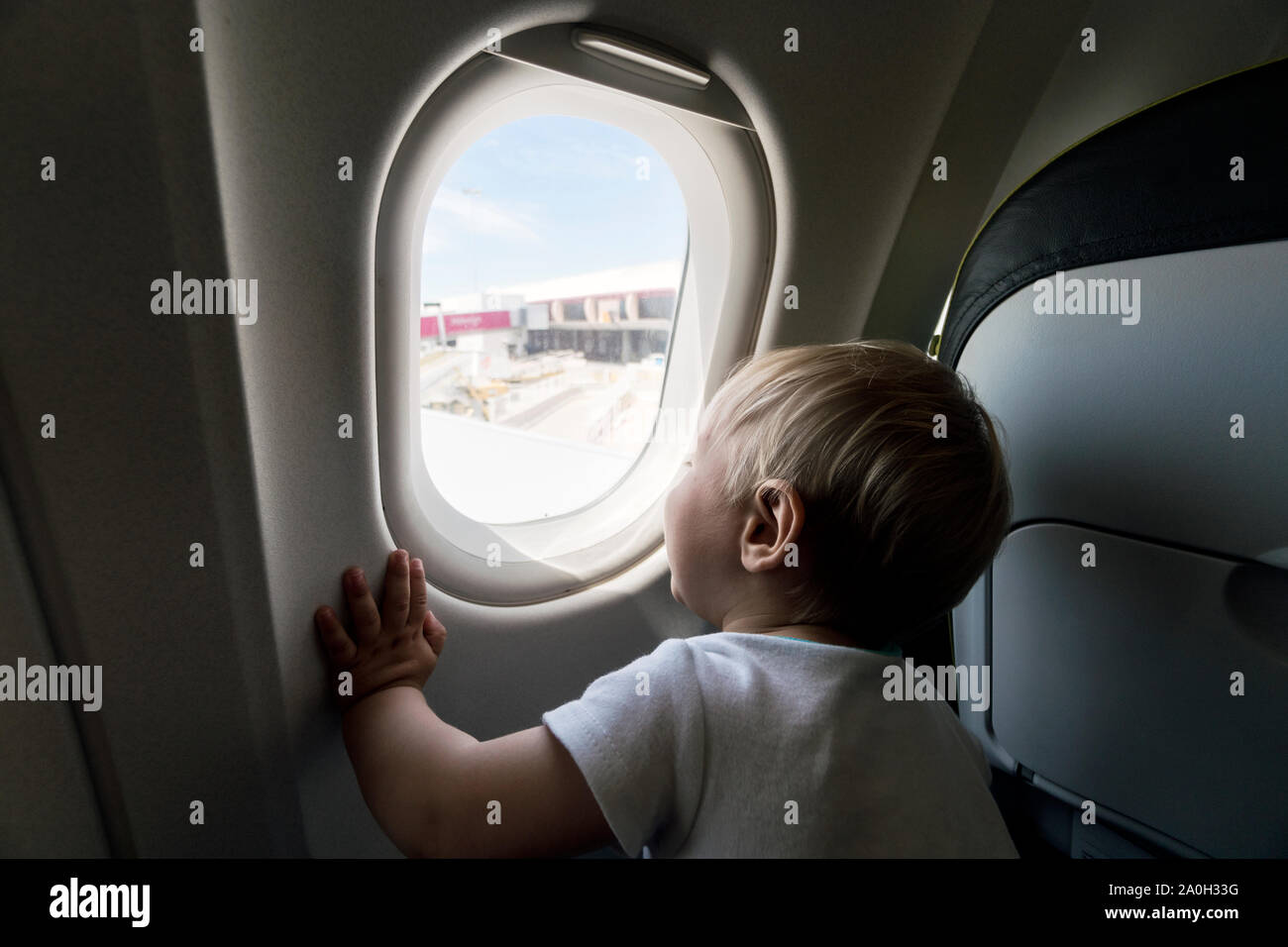 Boy child inside plane hi-res stock photography and images - Alamy