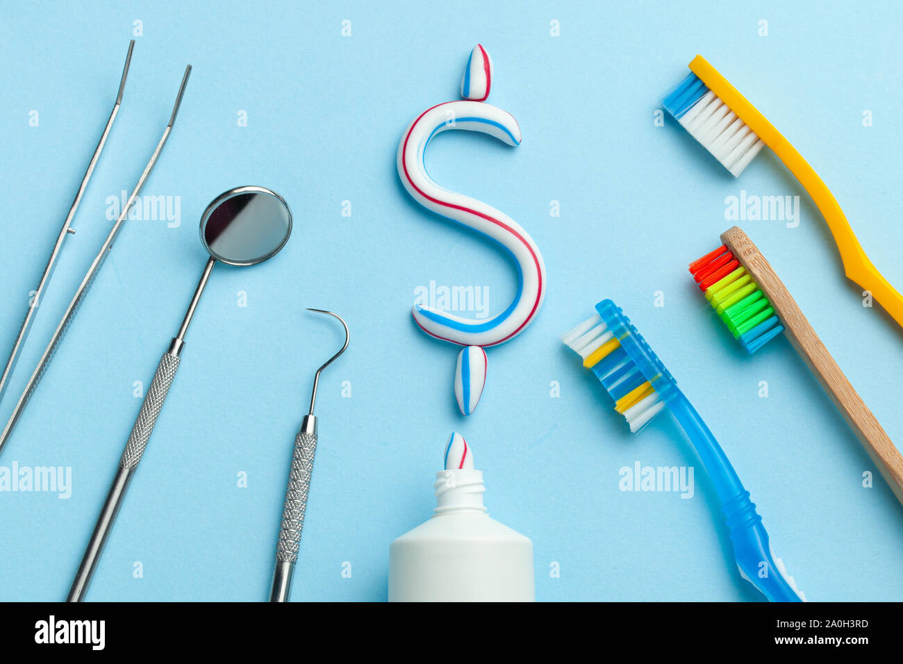 Dollar Sign Of Toothpaste Tube Of Colored Toothpaste And A Toothbrush