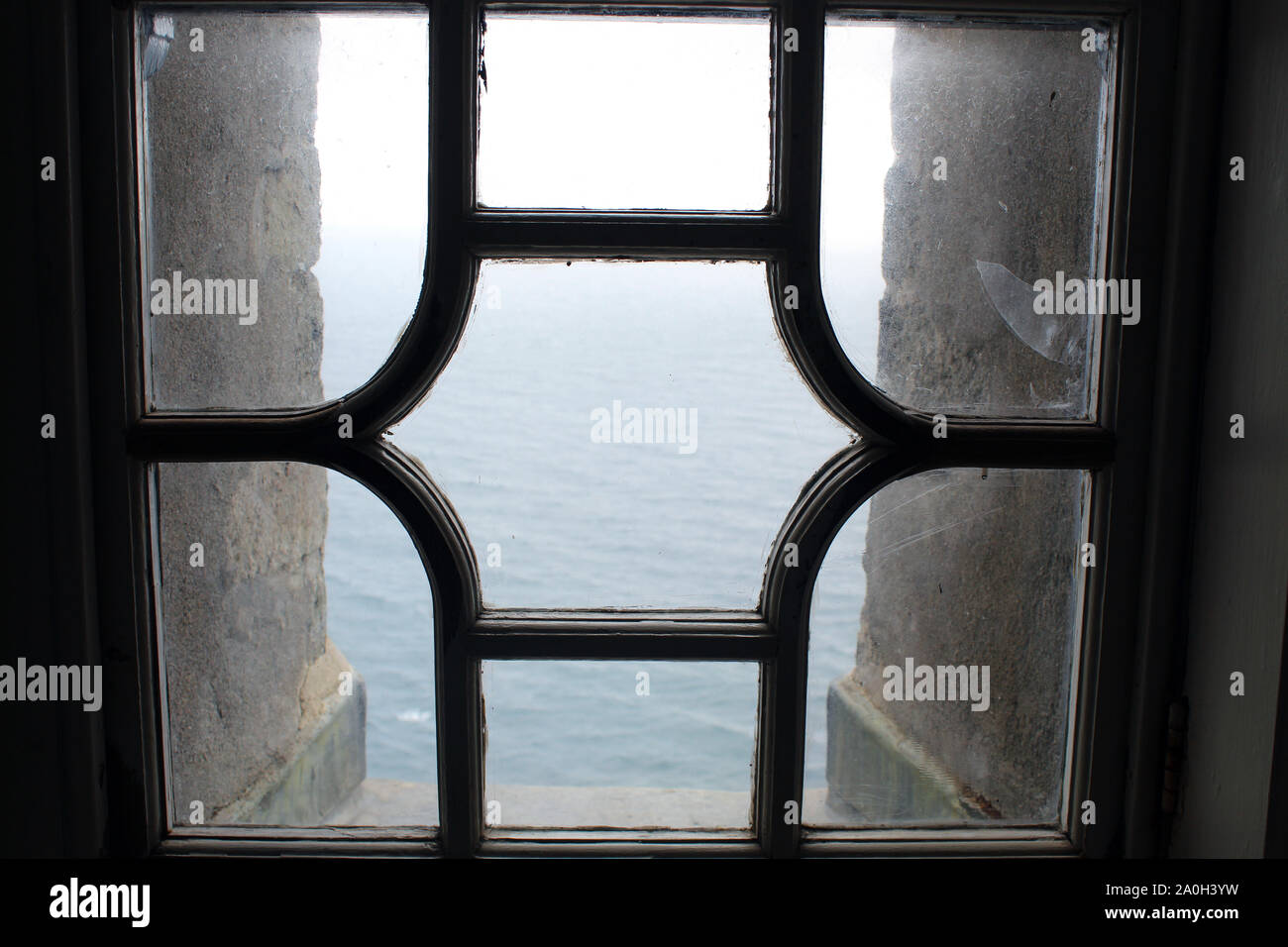 Sea view out old window Stock Photo - Alamy