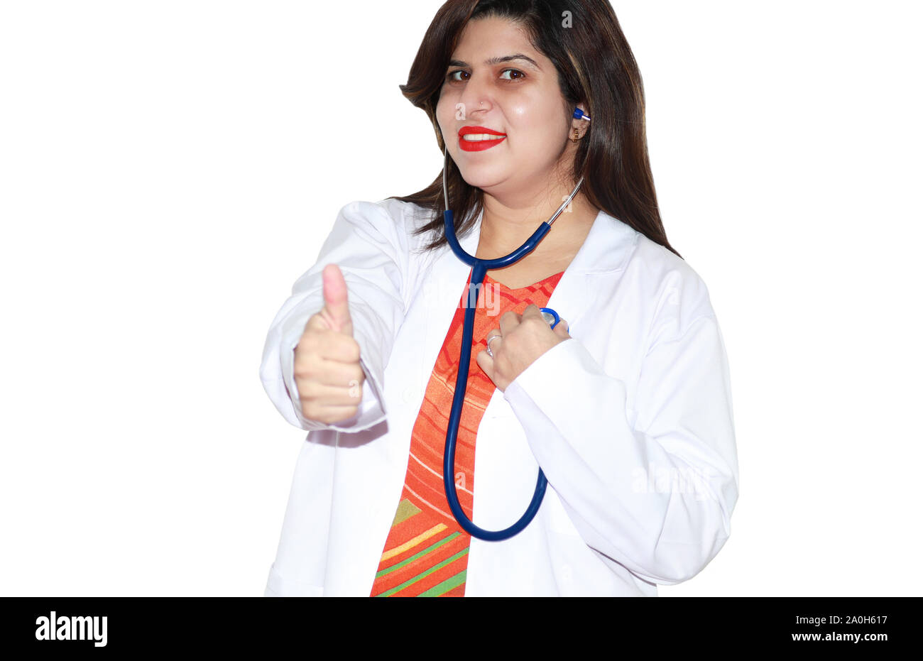 Female doctor of Indian ethnicity listen to heartbeat with stethoscope ...