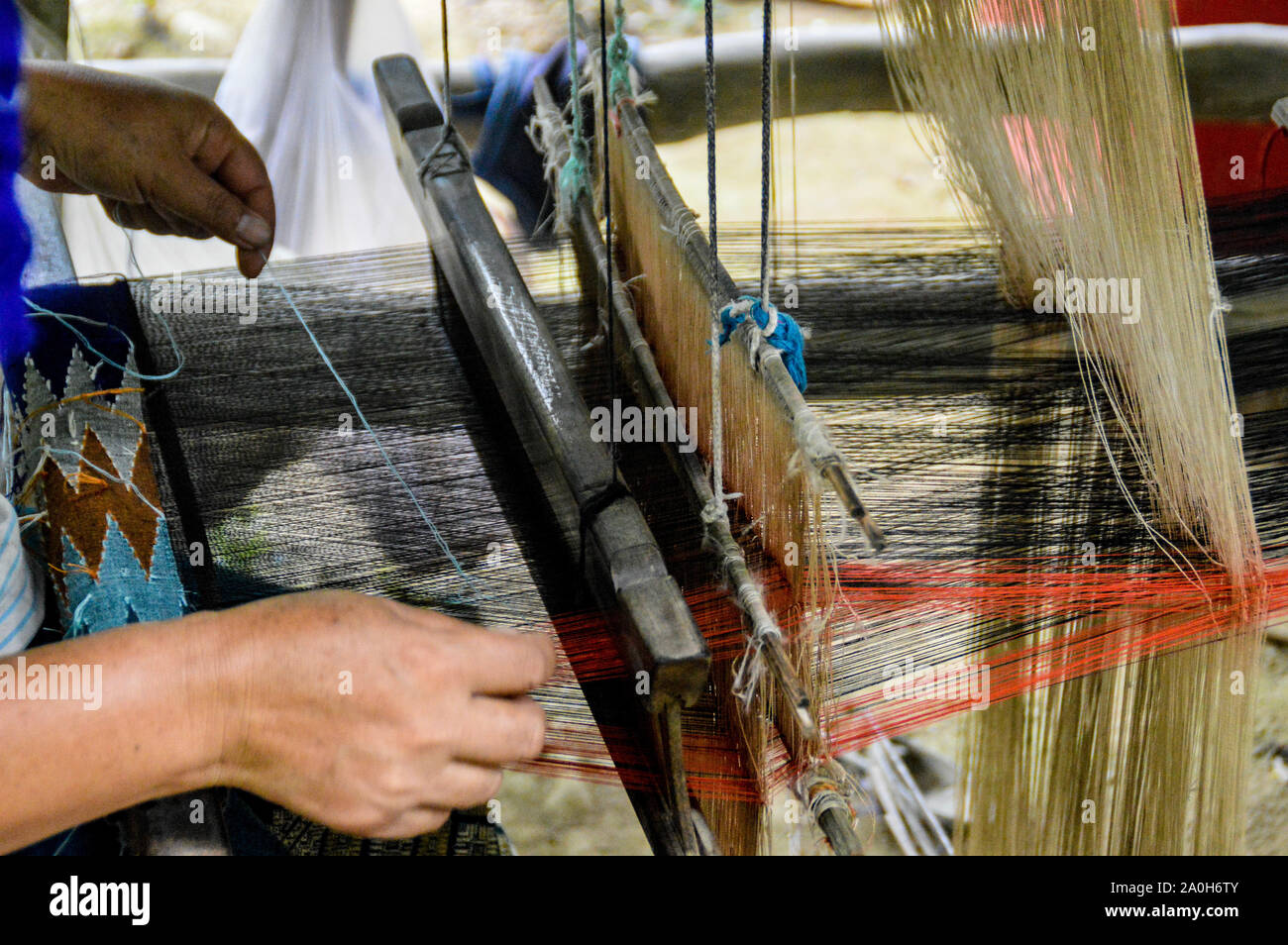 Traditional hand weaving of Laotian silks in the village near Luang ...