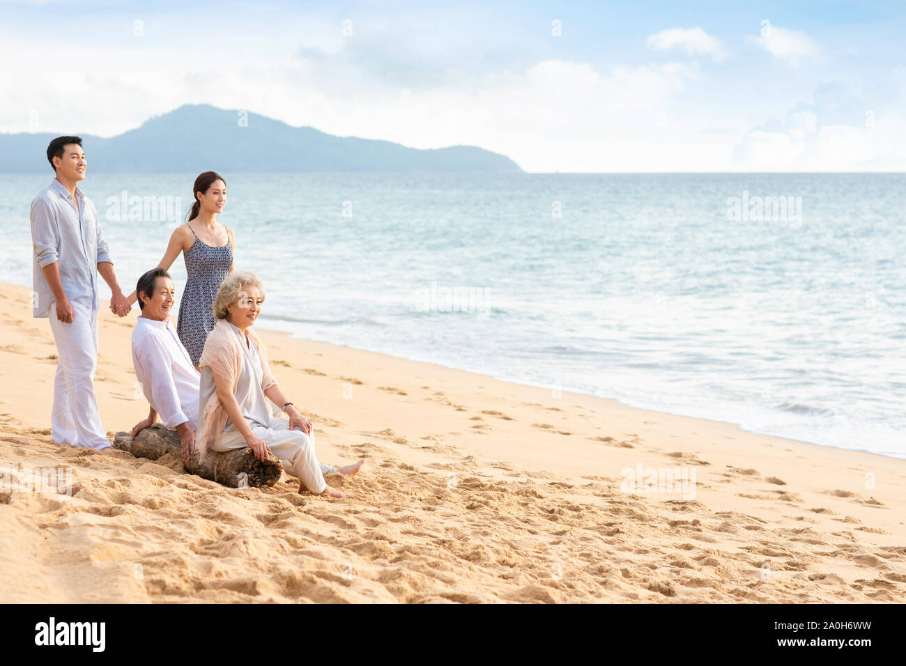 Happy family on beach Stock Photo - Alamy