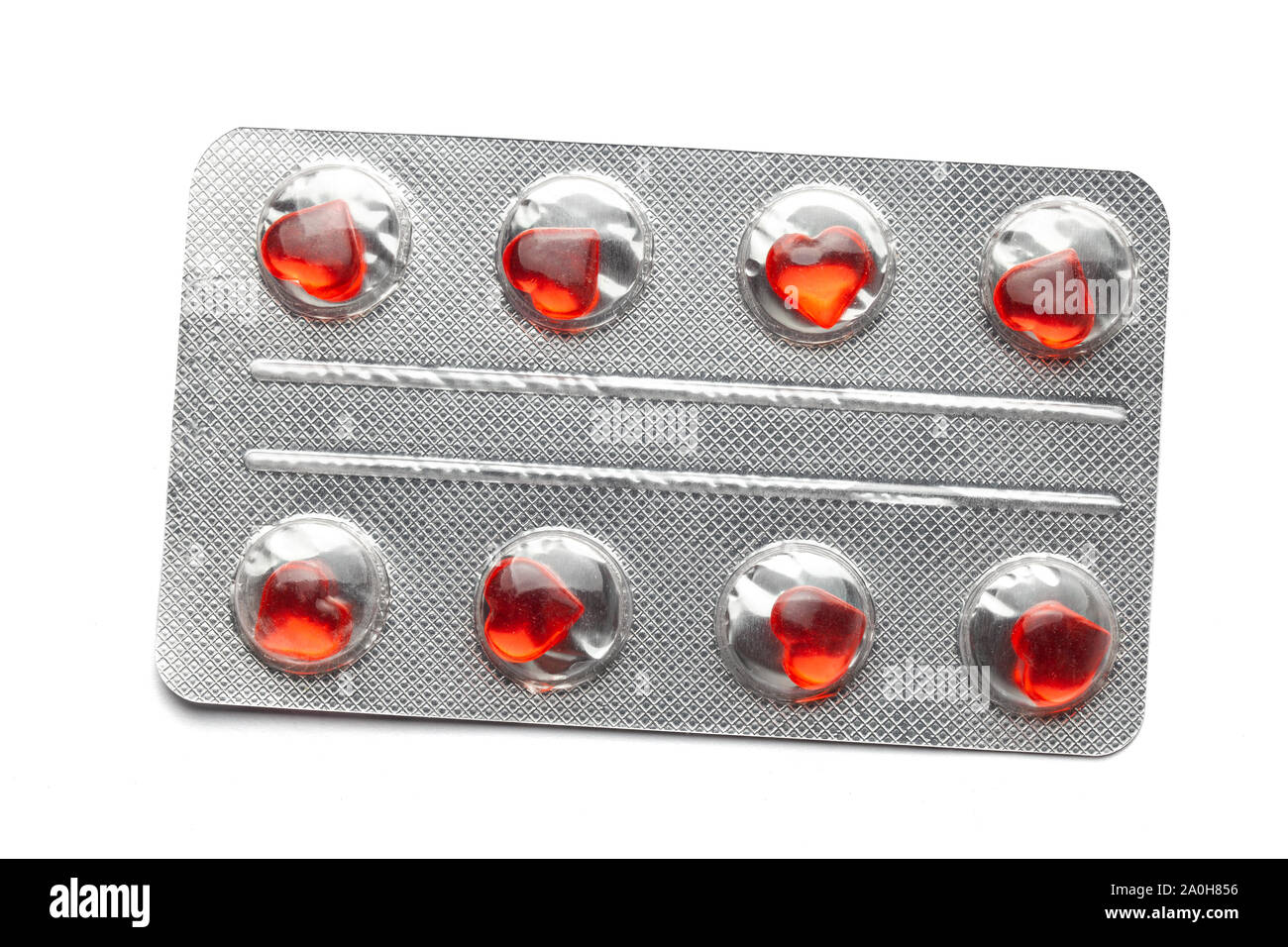 Love pills. Blister pack with red heart shaped pills. Tablets for ...