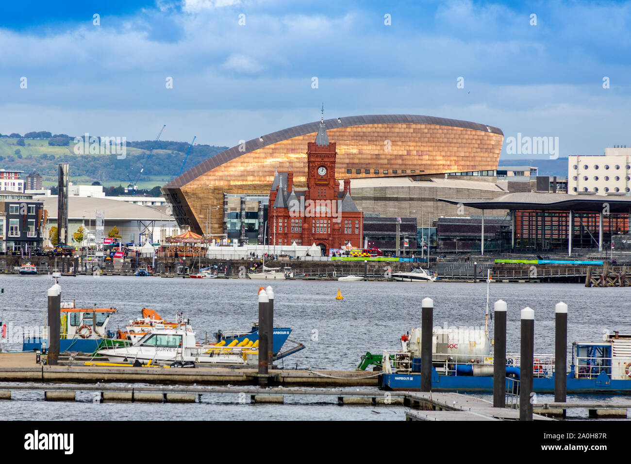 A shaft of sunlight lights up the Millennium Centre and red brick ...