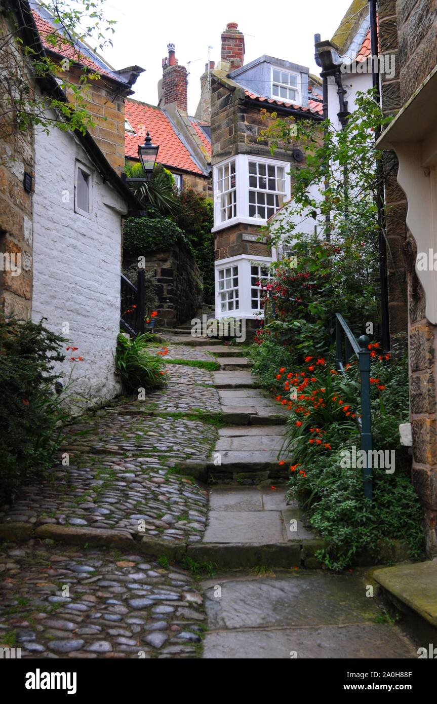 Street in Robin Hood's Bay leading to Peacock Row, North Yorkshire, UK ...