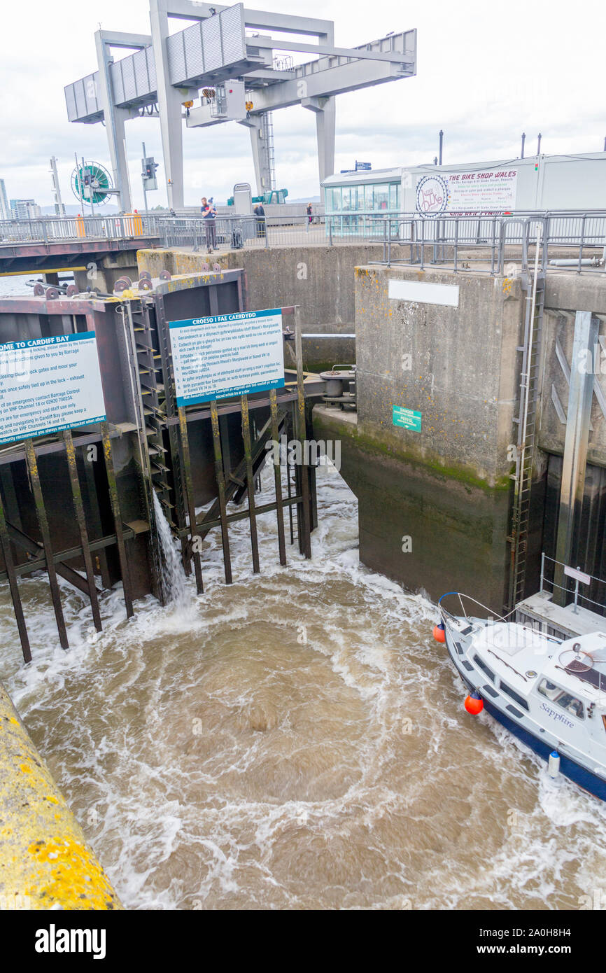 Water rushes in to one of the locks that give access to Cardiff Bay ...