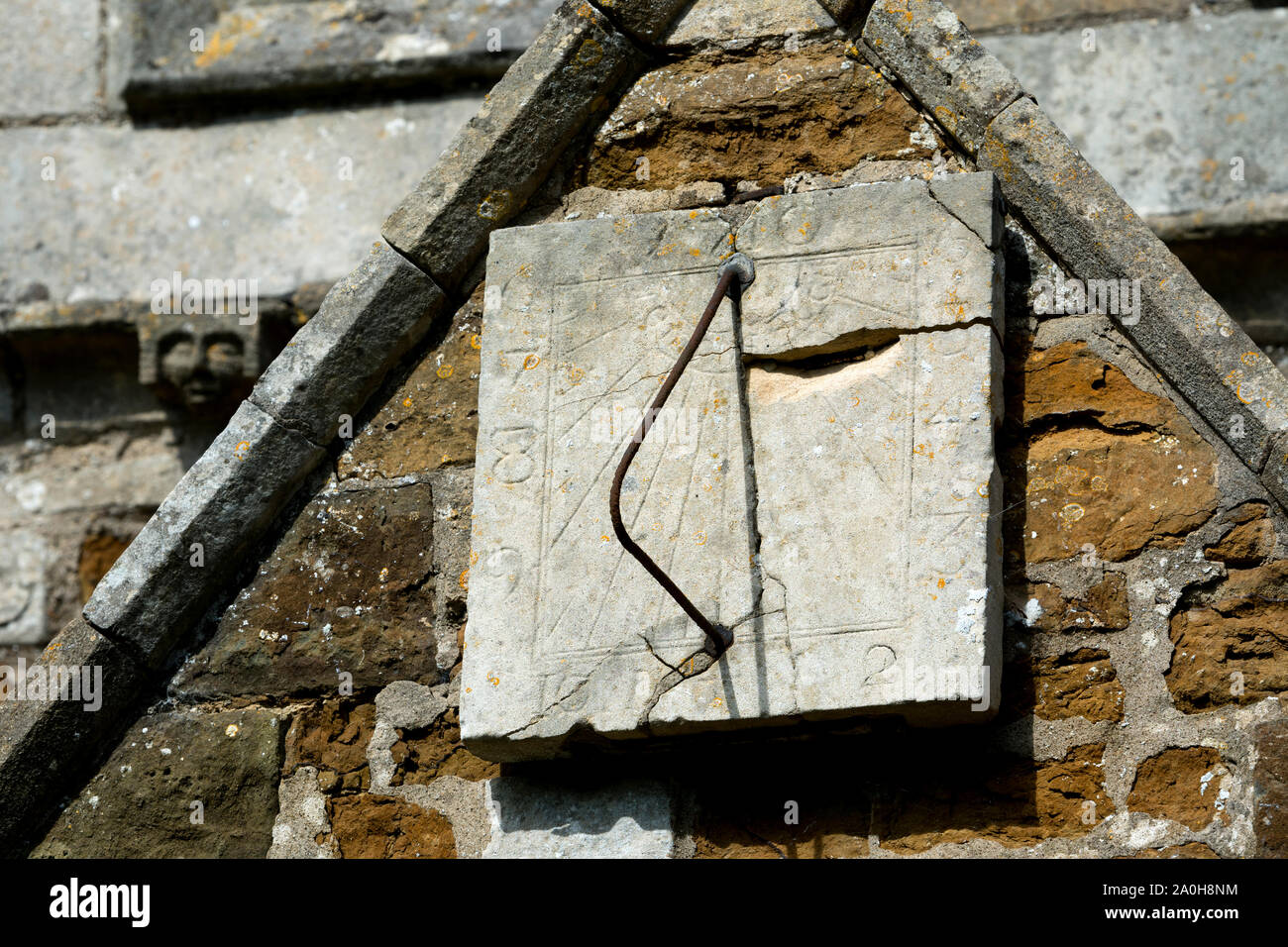 A sundial over the south porch of St. Peter`s Church, Tilton on the ...