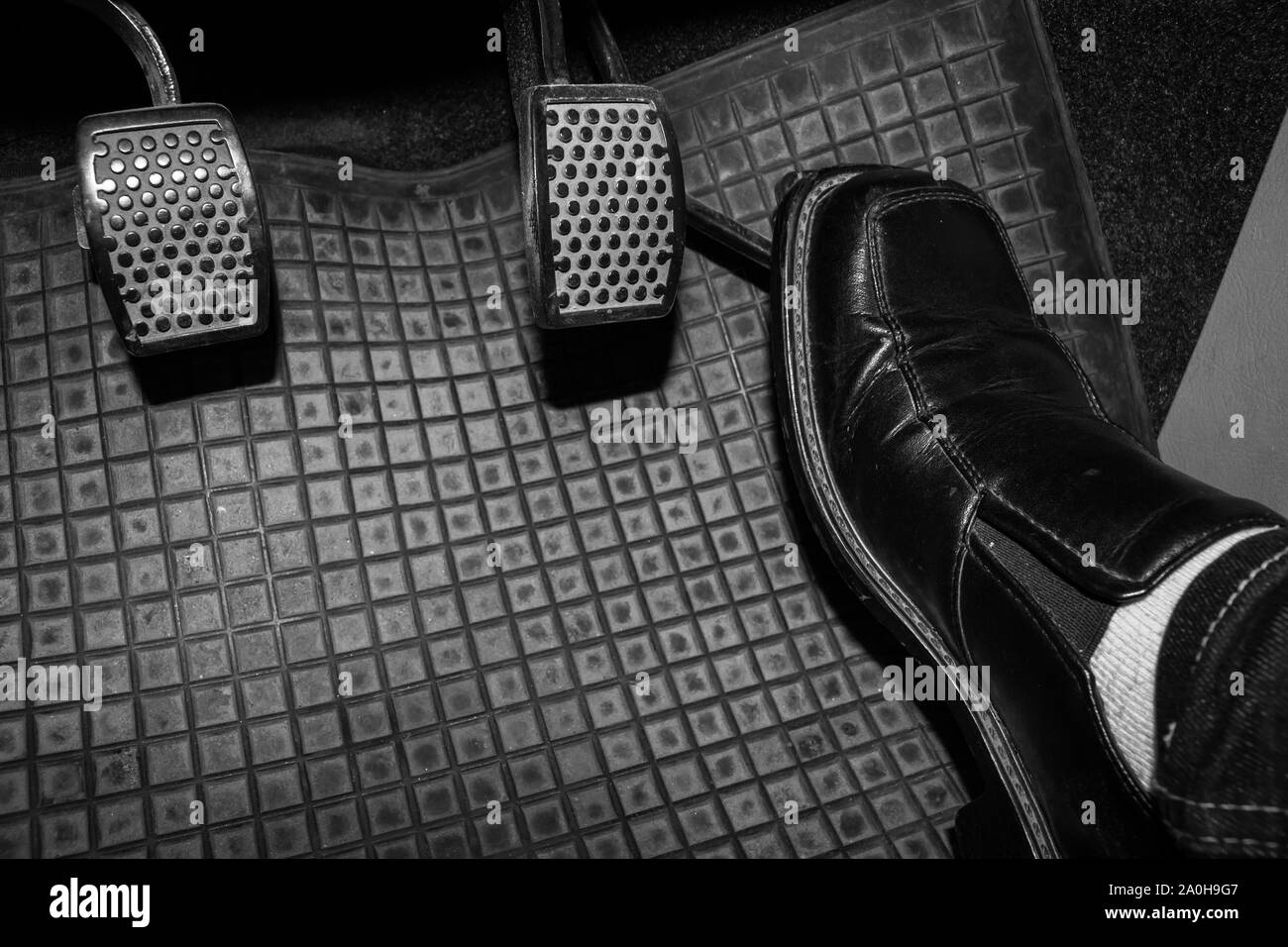 Foot while driving pedal to control the speed of the drive Stock Photo ...