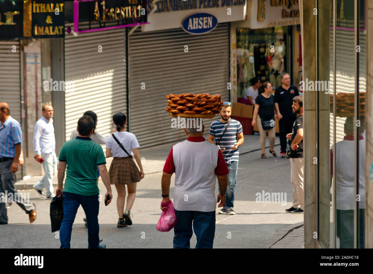 Bagel Seller (Known as simit or Turkish bagel) carries a tray of bagels ...