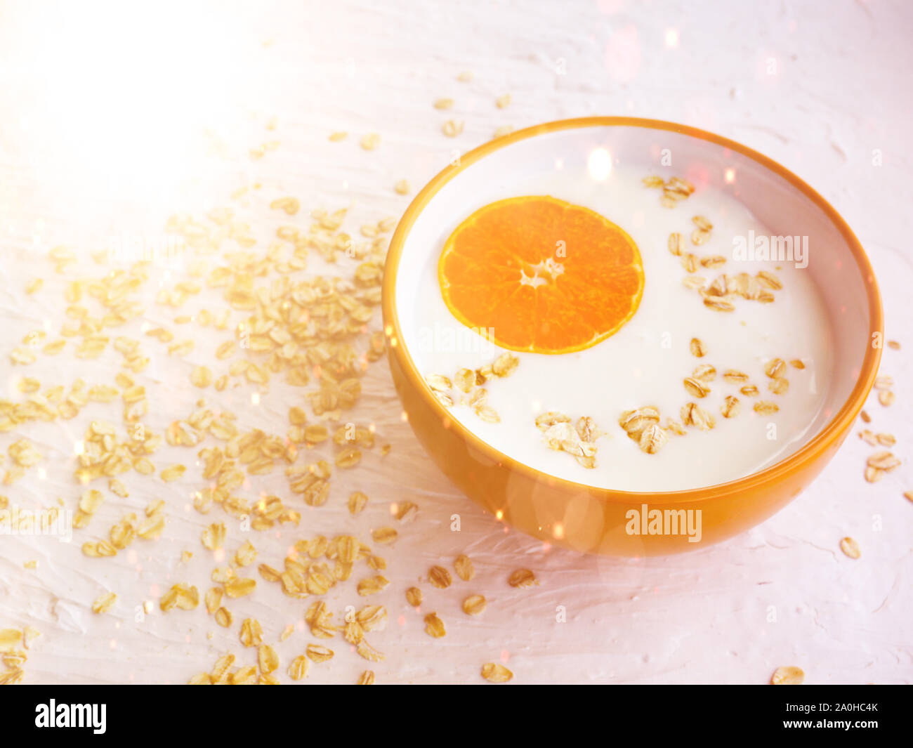 Oatmeal porridge on milk with Mandarin and kiwi Stock Photo - Alamy