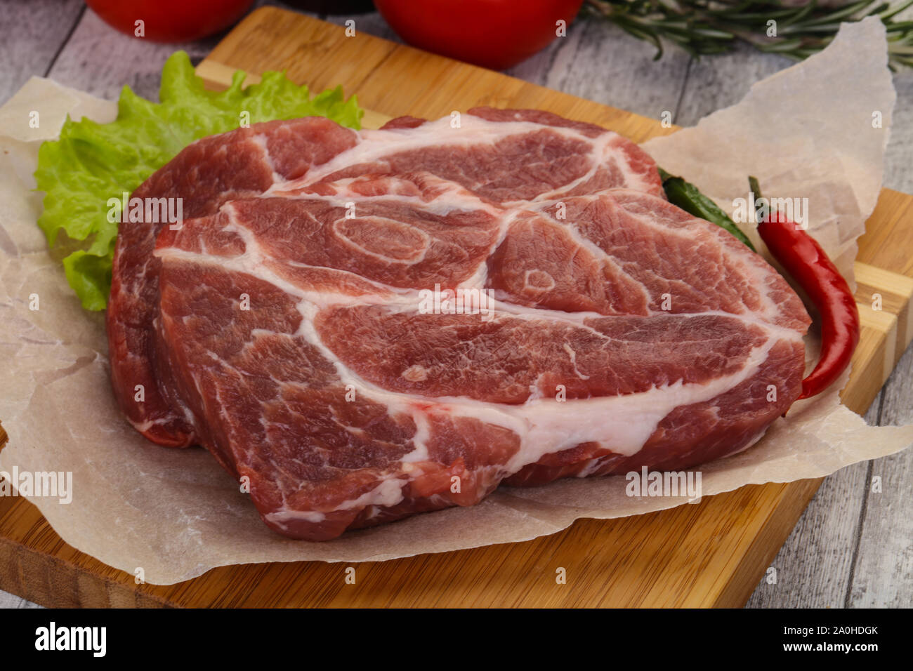 Raw pork neck steak ready for cooking Stock Photo - Alamy