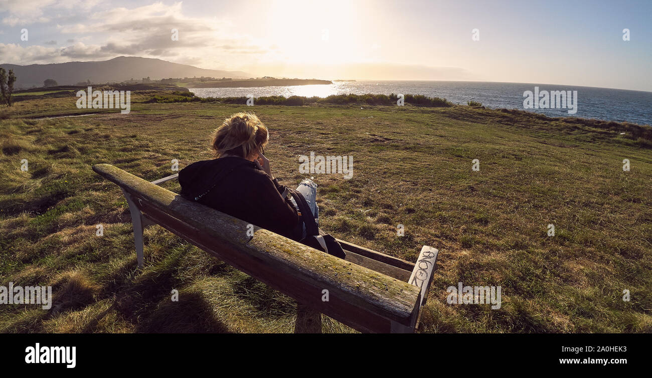 Young woman contemplating the landscape near the horizon Stock Photo ...