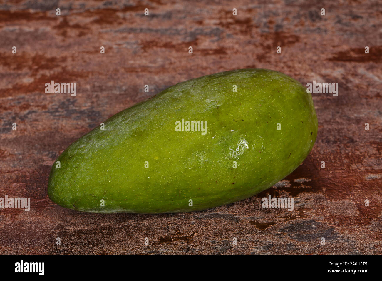 Green tasty mango over background Stock Photo - Alamy