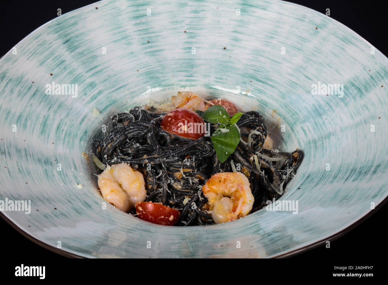 Black spaghetti pasta with tiger prawn Stock Photo - Alamy
