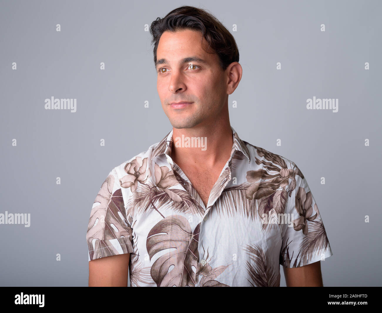 Face of handsome Hispanic tourist man thinking Stock Photo - Alamy