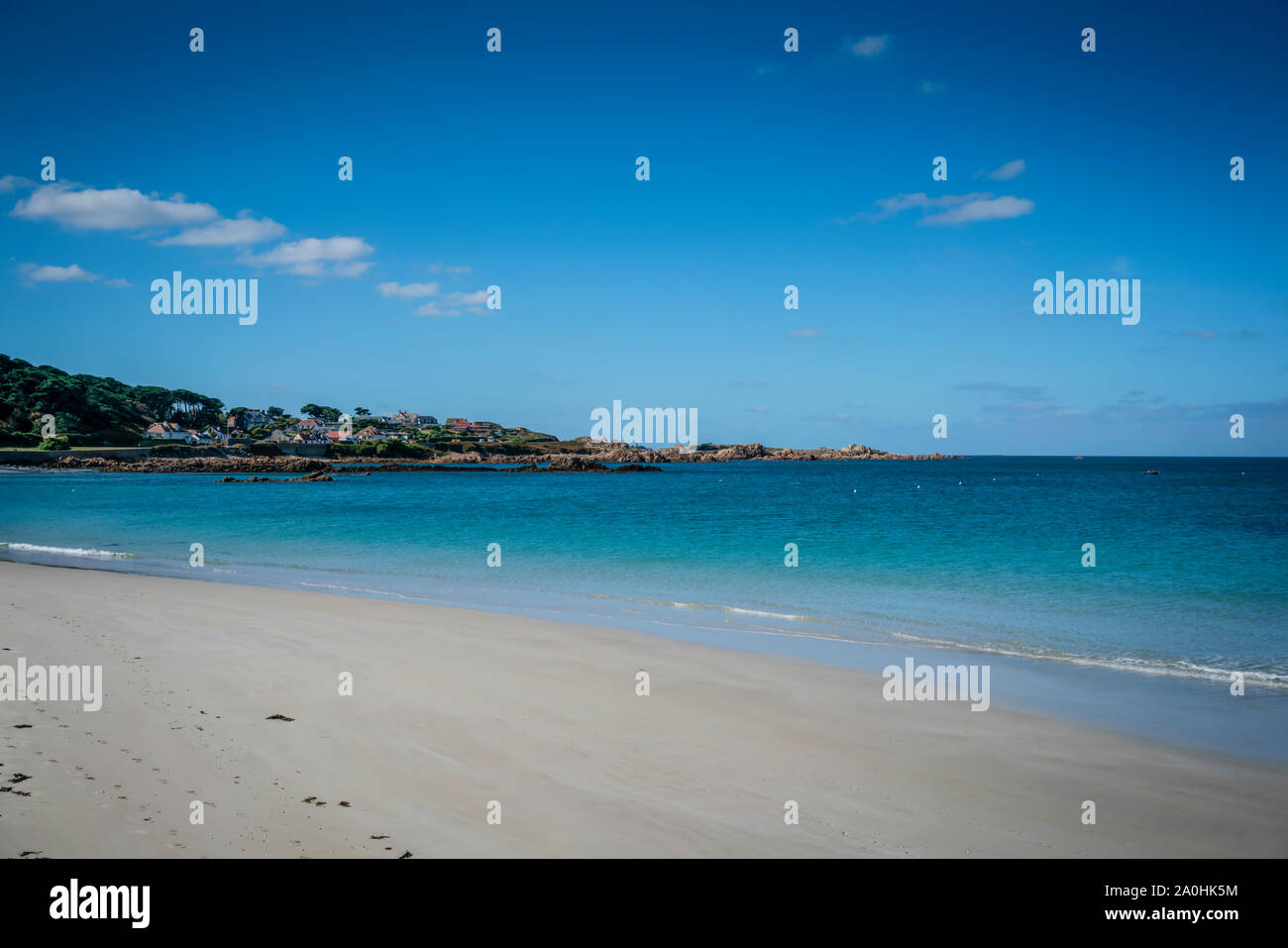 Beautiful sun drenched Cobo Bay on the west coast of the island of ...