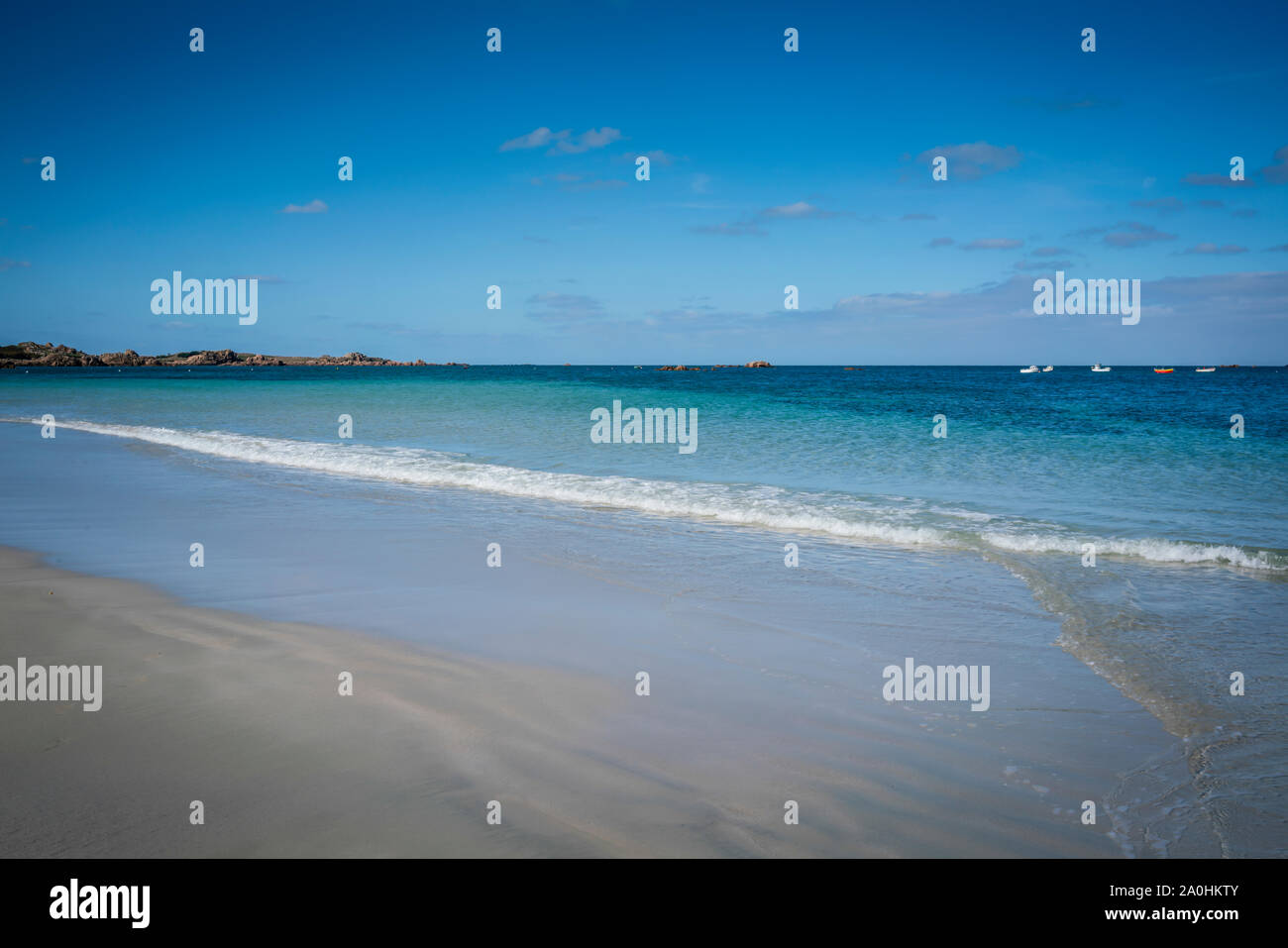 Beautiful sun drenched Cobo Bay on the west coast of the island of ...