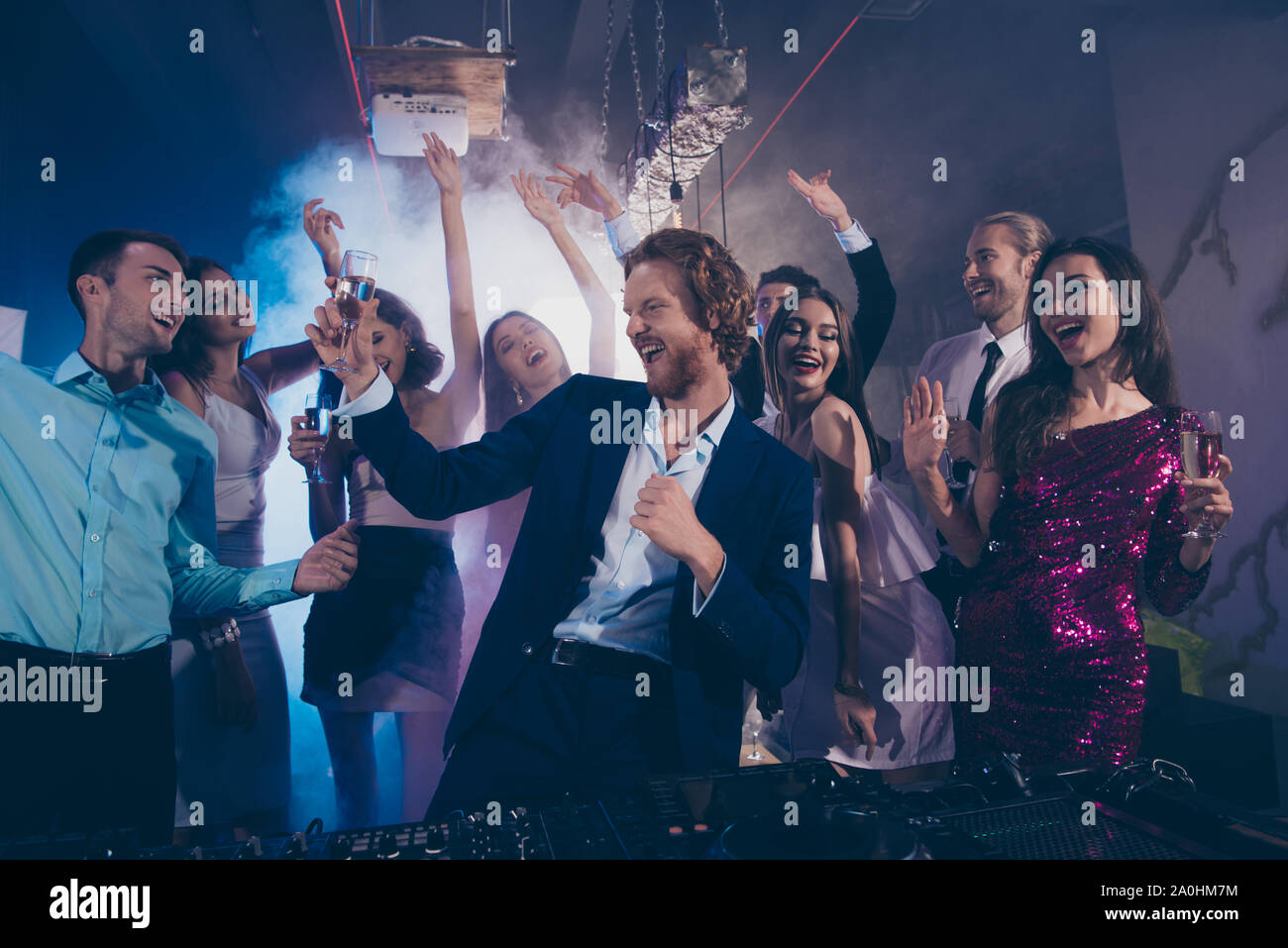 Attractive, handsome man in formal wear dance with glass of beverage ...