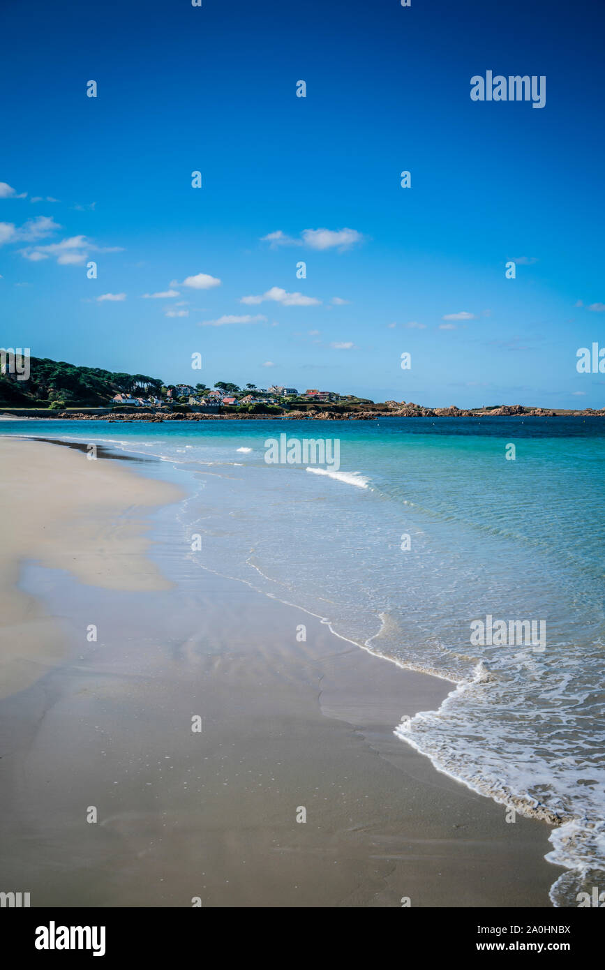 Beautiful sun drenched Cobo Bay on the west coast of the island of ...