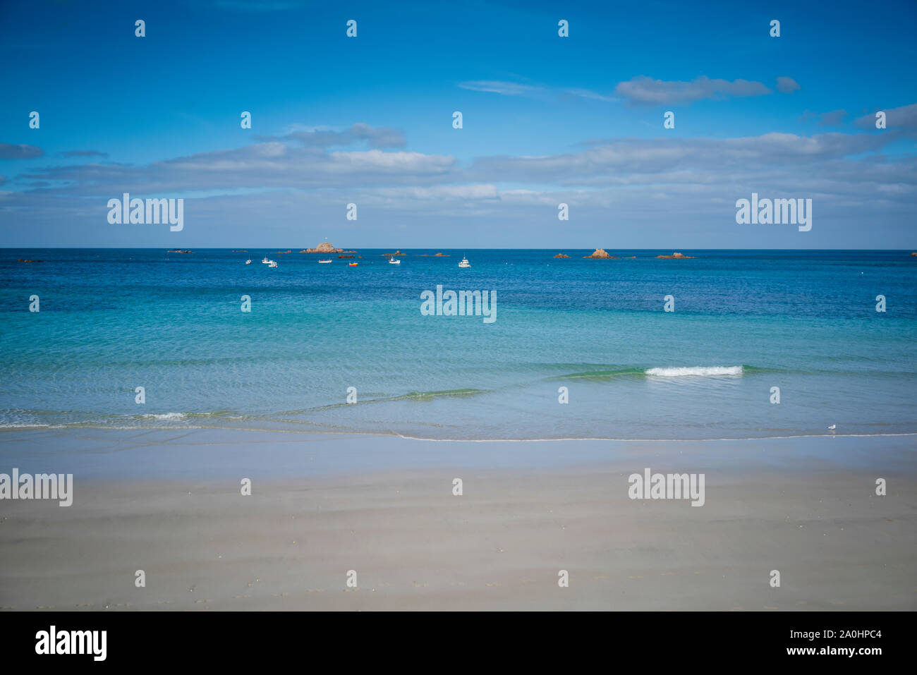 Beautiful sun drenched Cobo Bay on the west coast of the island of ...