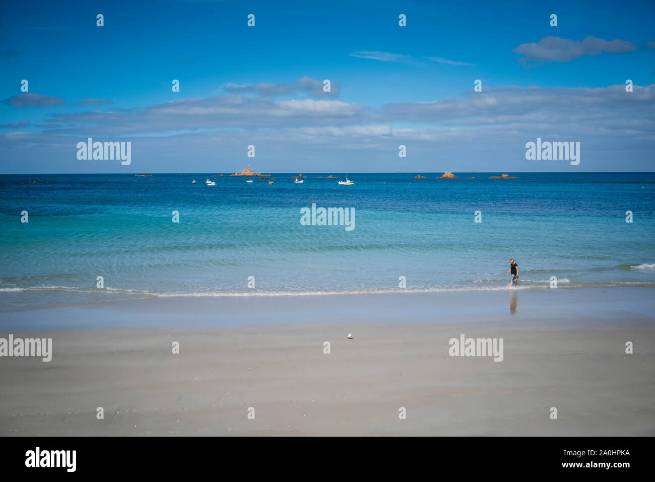 Beautiful sun drenched Cobo Bay on the west coast of the island of ...