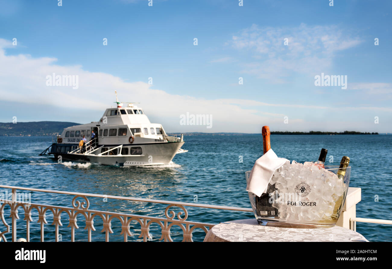 Fast ferry arriving at terminal in Lake Garda with champagne on ice in ...